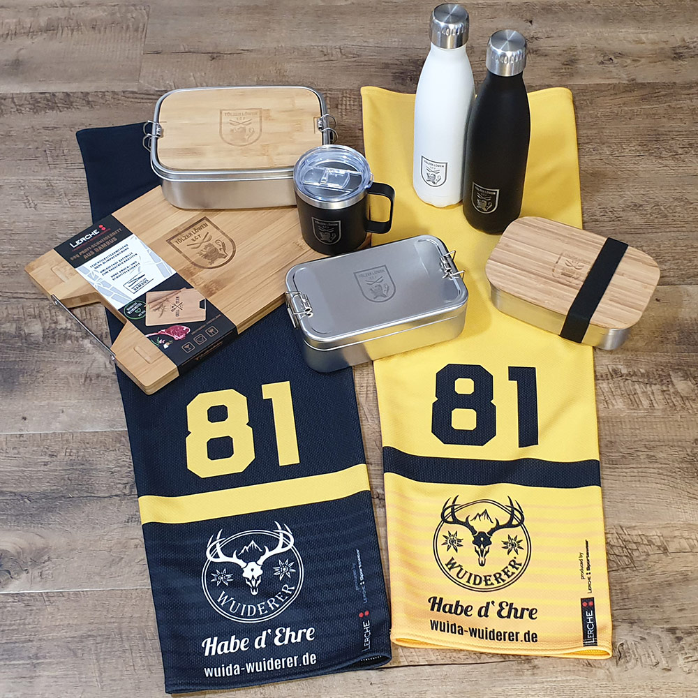 Fan-Artikel mit Lunchbox, Trinkflasche, Schneidebrett und Becher mit ...